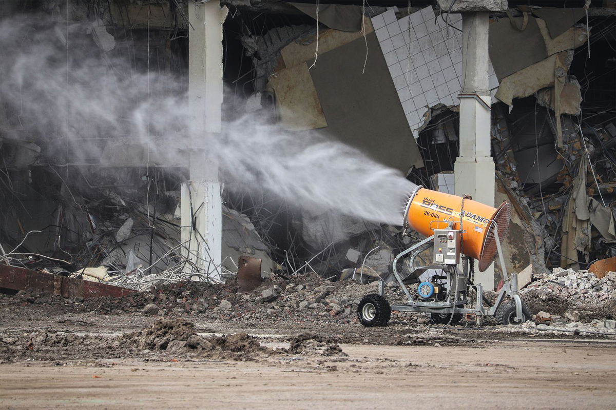 Dust control cannons in use for demolition and building material ...
