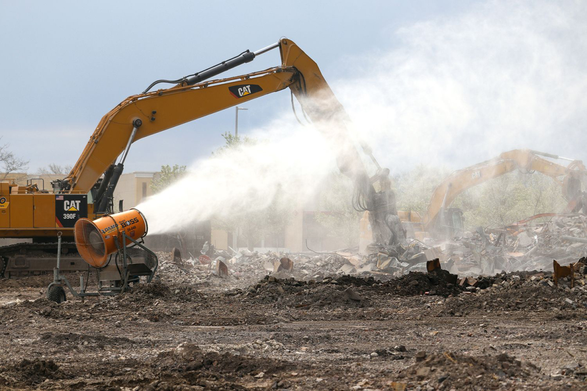 Dust control cannons in use for demolition and building material ...